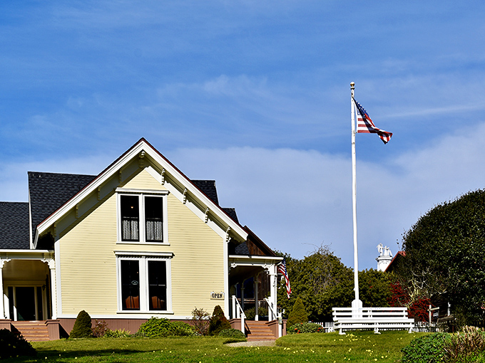 The Kelley House Museum stands as a sunny sentinel to Mendocino's past, complete with white picket fence that practically demands a Norman Rockwell painting.