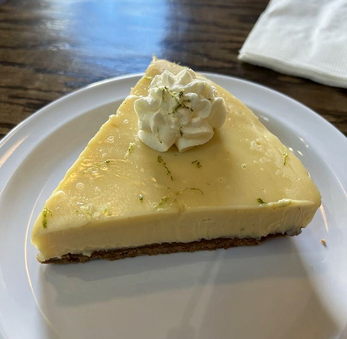 This key lime pie isn't just dessert—it's a citrusy revelation topped with a cloud of whipped cream that would make Florida jealous.