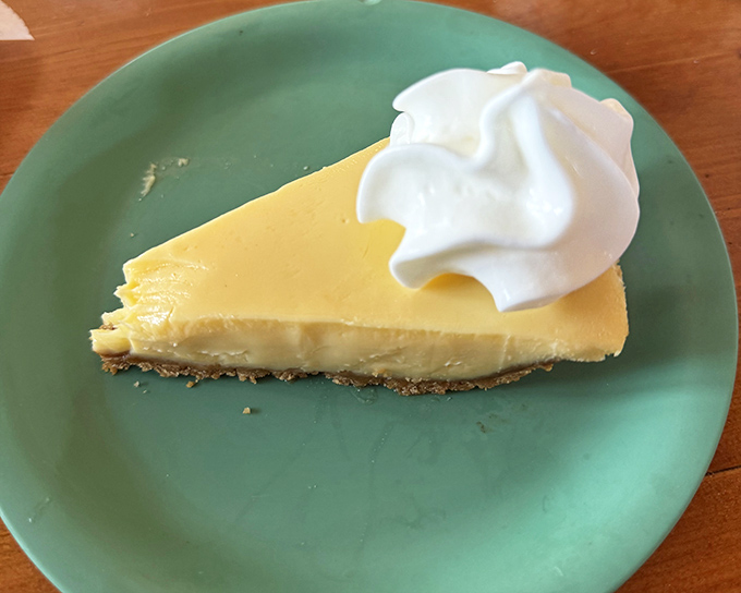 Key lime pie that strikes the perfect balance between tart and sweet. That dollop of whipped cream isn't just decoration—it's the perfect dance partner.