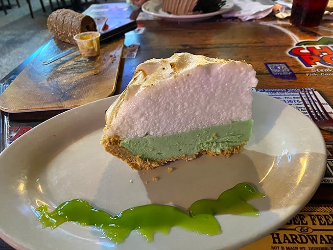 Behold the slice that launched a thousand road trips &ndash; key lime perfection with whipped cream clouds above.