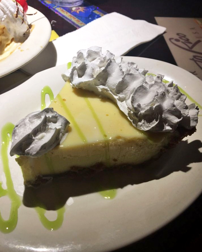 This key lime pie wears its whipped cream crown like royalty - and tastes like a Florida vacation on a fork.