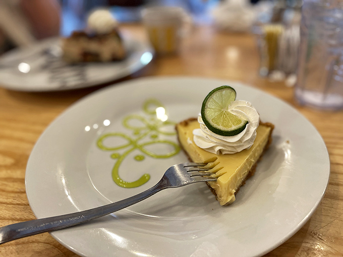 Key lime pie that strikes the perfect balance between tart and sweet. That artful lime garnish isn't just showing off&mdash;it's promising zesty authenticity in every bite.