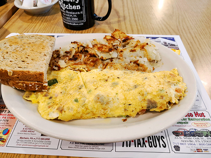 Breakfast alchemy at its finest—a perfect omelet alongside home fries that somehow manage to be both crispy and tender. The toast? Just waiting to mop up every last morsel.