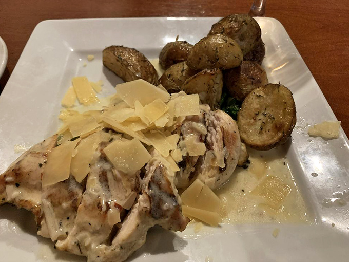 This lemon chicken doesn't just sit on the plate; it lounges confidently alongside herb-roasted potatoes like it knows exactly how good it is.