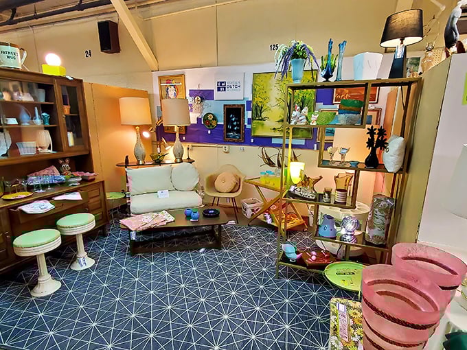 Mid-century modern meets retro chic in this perfectly staged booth. That geometric blue carpet? Pure 1960s magic that would make Don Draper nod approvingly.