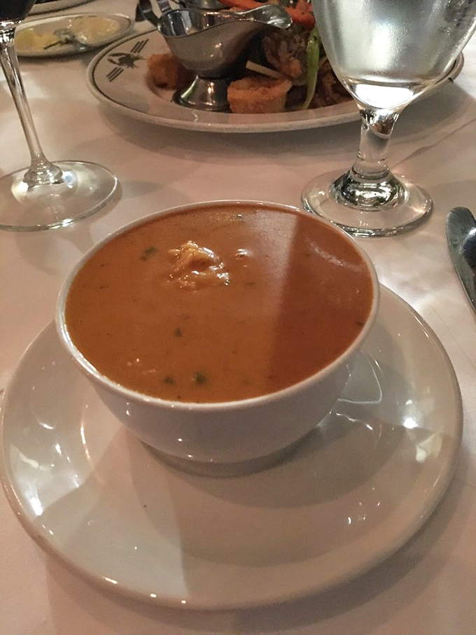 The Lobster Bisque arrives like a liquid sonnet&mdash;velvety, rich, and telling tales of crustacean adventures with each spoonful.