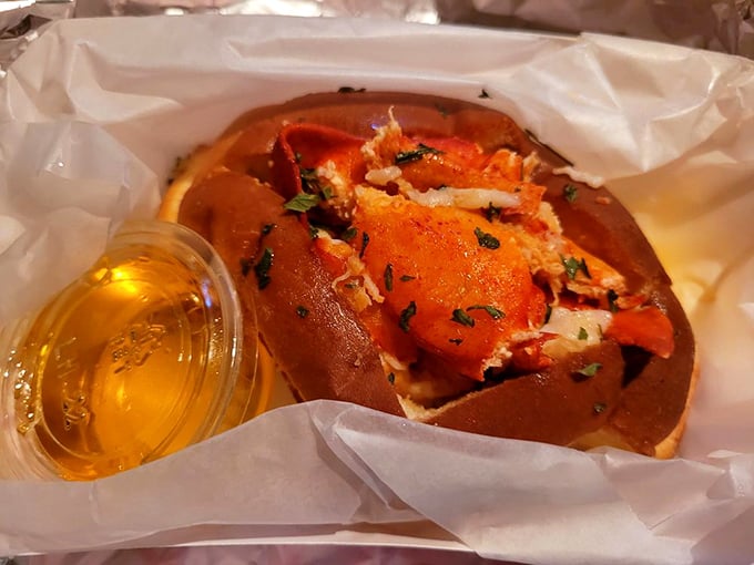 This lobster roll isn't messing around&mdash;chunks of sweet meat nestled in a buttery bun with a side of liquid gold. New England, eat your heart out.