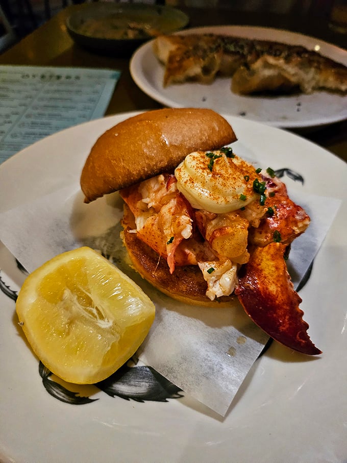 The legendary lobster roll arrives like Neptune's gift&mdash;chunks of sweet meat barely contained by a toasted bun, with a claw dramatically announcing its presence.