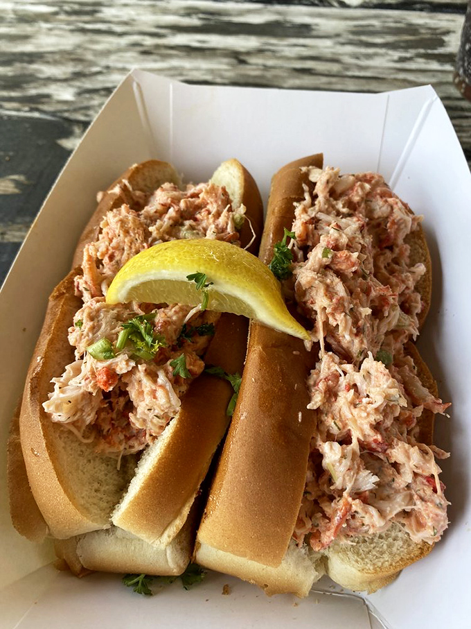 Lobster roll nirvana has been achieved! Split-top buns cradling sweet lobster meat with just a whisper of dressing and that essential lemon wedge.