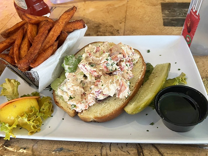 The Maine event: chunks of sweet lobster meat nestled in a perfectly toasted roll. This isn't just lunch&mdash;it's a religious experience with a side of crispy fries.
