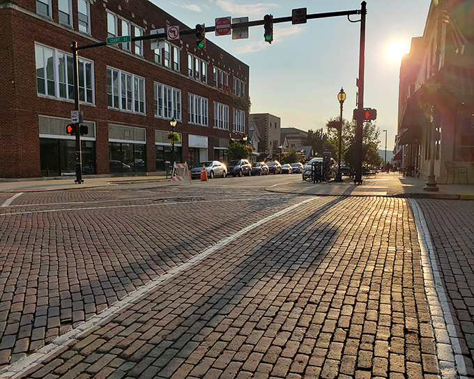 Sunset bathes Union Street in golden light, transforming ordinary brick into a warm tapestry that would make even Mister Rogers feel at home.