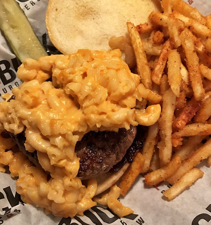 Mac and cheese that doesn't just sit on a burger&mdash;it crowns it like cheesy royalty. The ultimate comfort food power couple.