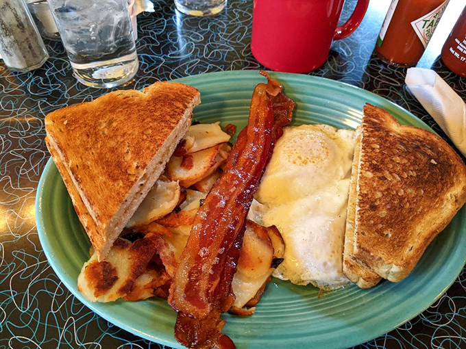 Breakfast architecture at its finest&mdash;golden toast, perfectly crisp bacon, and eggs that would make a chicken proud.