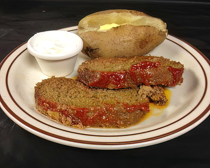 Behold the star attraction: meatloaf that would make your grandmother both proud and slightly jealous. That glaze is practically edible sunshine.
