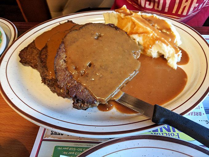 Behold the star attraction: meatloaf draped in rich gravy alongside creamy mashed potatoes. Grandma would approve&mdash;and possibly get jealous.