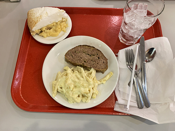 Behold the star attraction: Mehlman's legendary meatloaf alongside creamy macaroni salad. No filters needed for this kind of food porn.