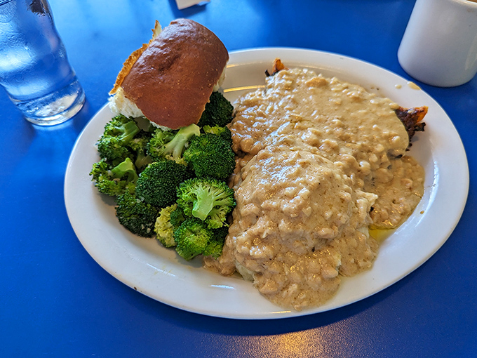 Behold the star attraction: meatloaf swimming in savory gravy alongside fresh broccoli. This isn't your mother's meatloaf&mdash;unless your mother was secretly a culinary genius.