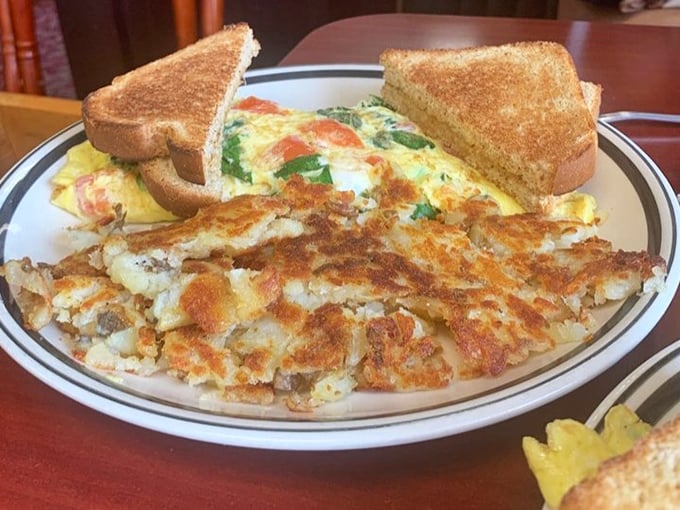 A proper omelet should be a canvas of possibility. This Mediterranean masterpiece, bursting with veggies and perfectly browned potatoes, makes a compelling breakfast argument.