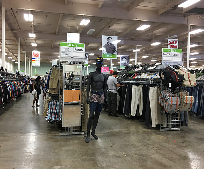 Men's fashion democracy in action&mdash;where vintage band tees and office-ready slacks coexist peacefully under the watchful gaze of bygone style icons.