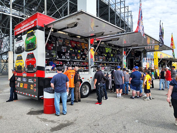 NASCAR passion takes physical form at the merchandise stands, where fans gather to claim their piece of Monster Mile memorabilia.