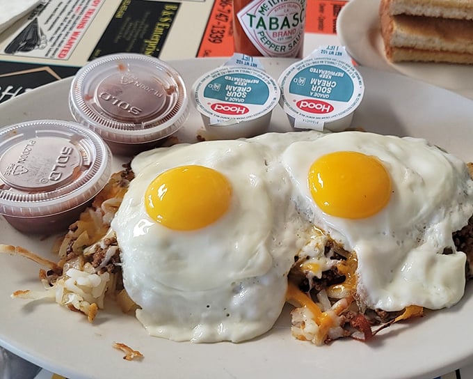 Two sunny-side-up eggs crown this Mexican skillet like royal jewels, their golden yolks ready to create the perfect breakfast sauce.