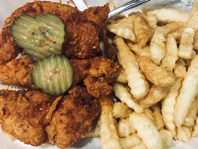 Golden-brown tenders with pickle coins standing guard over a mountain of crinkle-cut fries&mdash;comfort food that's dressed for a spicy occasion.