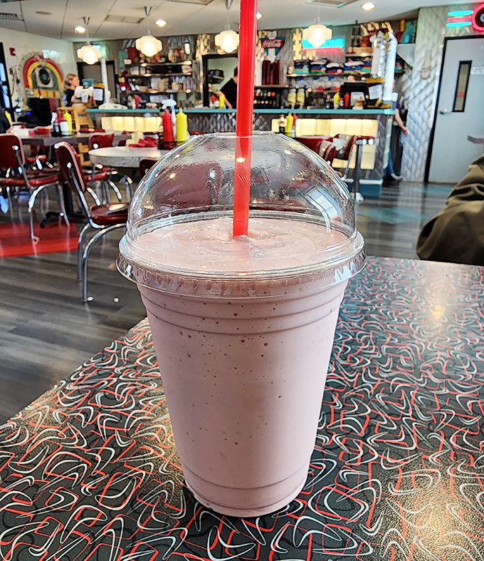Strawberry shake perfection in a plastic cup. One sip and suddenly you're contemplating whether to start a sock hop right there.