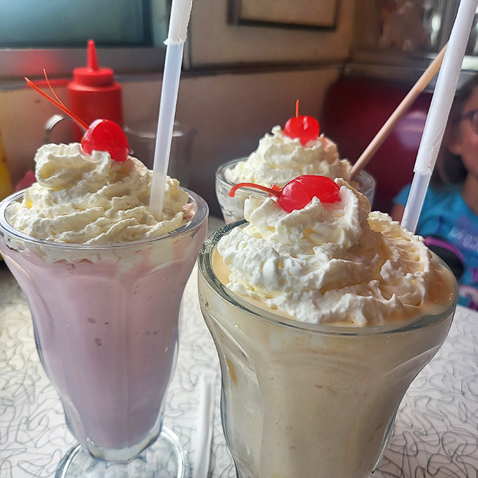 Milkshake masterpieces crowned with whipped cream mountains and cherry beacons&mdash;these aren't just desserts, they're dairy-based works of art worth the brain freeze.