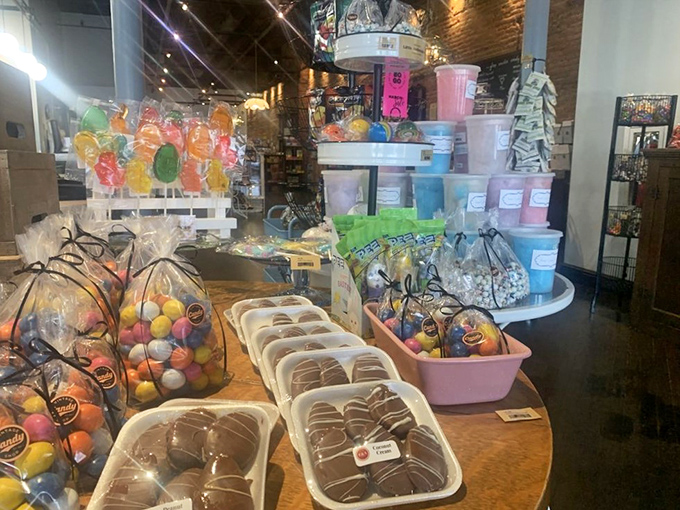 Sweet treasure island! Those colorful lollipops standing like delicious sentinels guard an assortment of treats that would make Willy Wonka jealous.