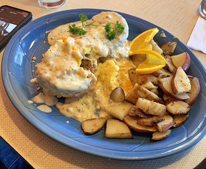 Behold the Mountain Man breakfast&mdash;where gravy cascades over biscuits like a savory waterfall, with potatoes standing by for backup.