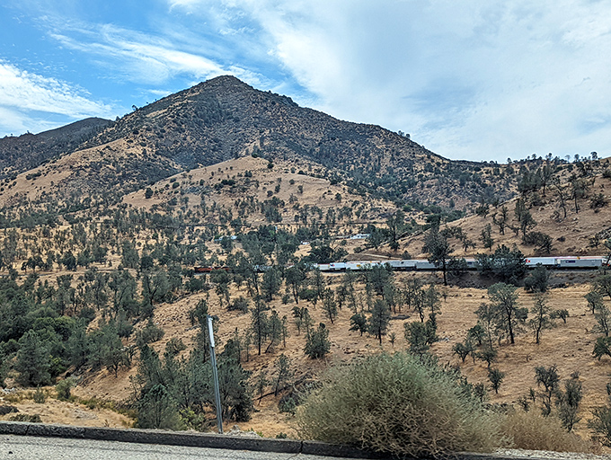 The Tehachapi Loop's natural amphitheater showcases nature's grandeur with a side of engineering marvel. Trains never looked so picturesque!