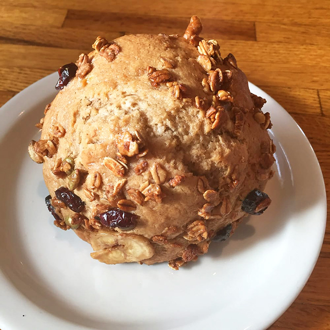 Meet the muffin that launched a thousand return visits. This honey bran beauty with walnuts and raisins is architecture you can eat.