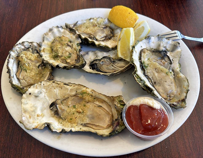 These aren't just oysters; they're briny jewels transformed by fire and butter into something that might make Neptune himself jealous.