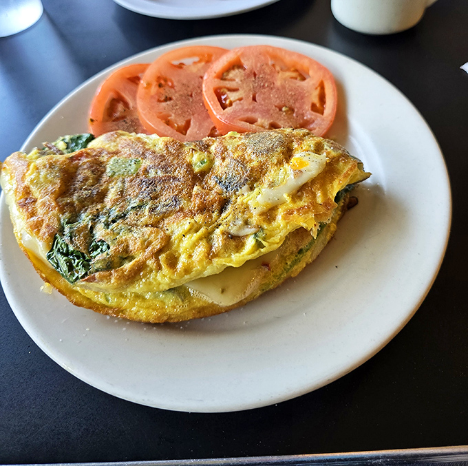The star of the show arrives: a perfectly executed omelet that makes you wonder if eggs have always tasted this good and you just forgot.