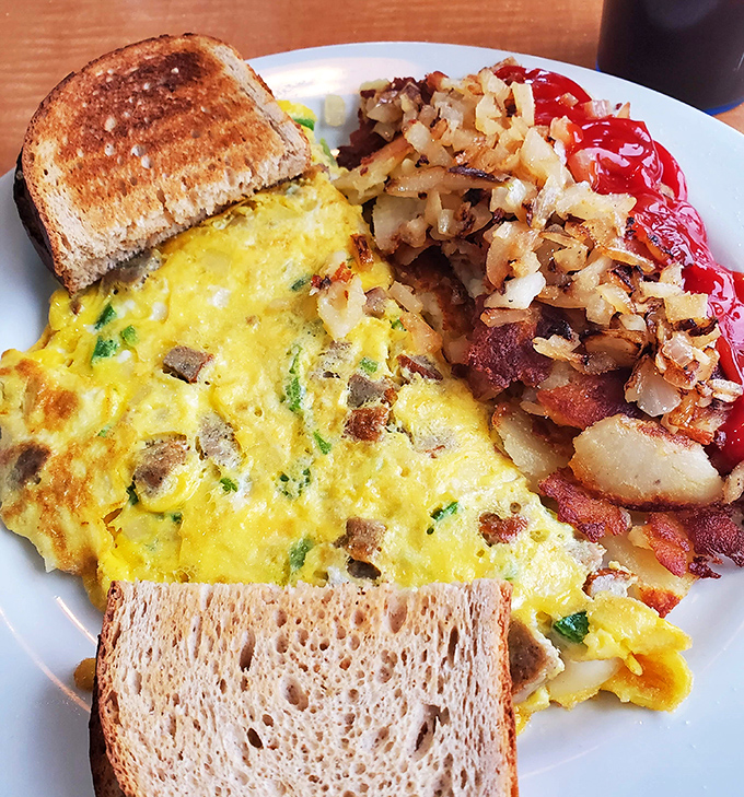 This isn't just breakfast, it's morning therapy&mdash;a perfectly executed omelet with crispy-edged hash browns that would make any short-order cook proud.
