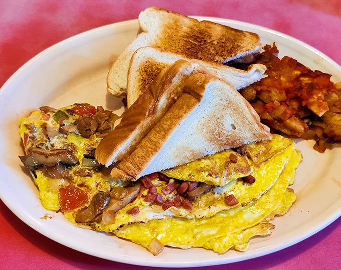 This omelet doesn't need Instagram filters to look good. Packed with fillings and served with perfectly golden toast, it's breakfast architecture at its finest.