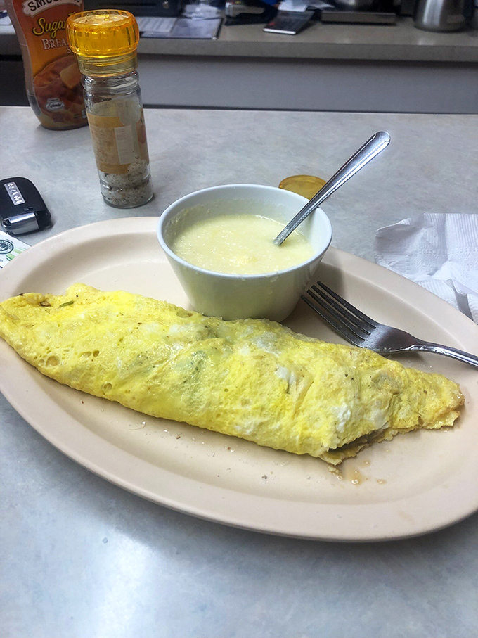 That omelet's fluffier than a cloud and those grits smoother than a jazz saxophone on a Sunday morning.