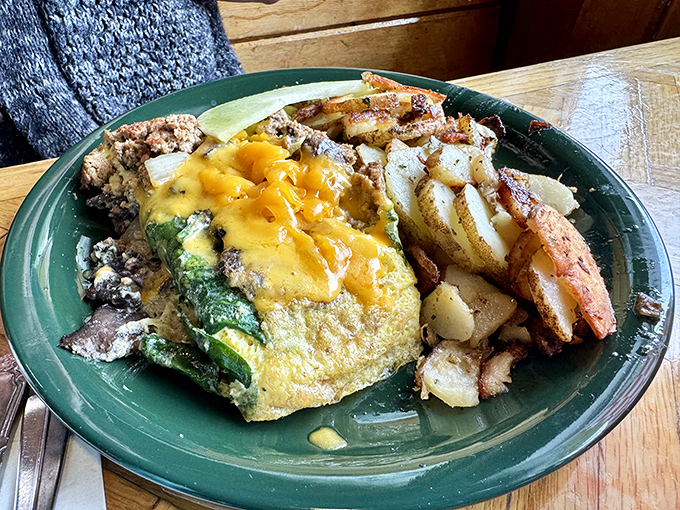 This isn't just an omelet&mdash;it's a masterpiece of morning artistry, where cheese cascades over vegetables like a sunrise over Tahoe.