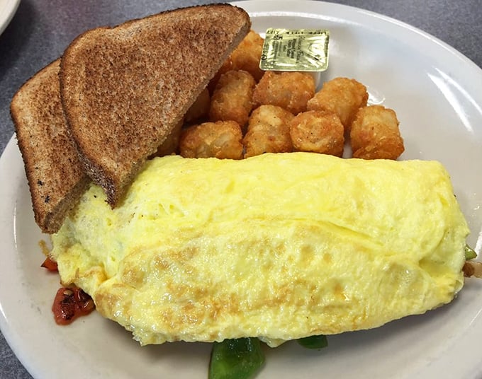 This omelet doesn't just arrive on your plate&mdash;it makes an entrance, fluffy and proud, with perfectly golden hash browns standing guard.