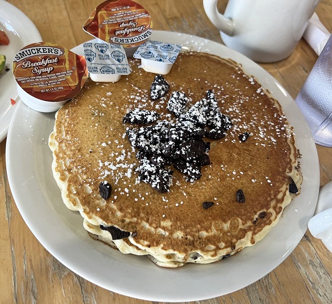 Pancakes that make you question all other pancakes you've ever eaten. That powdered sugar dusting? Chef's kiss.