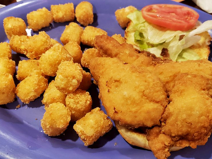 Golden-brown perfection! The famous oven-fried chicken arrives with a crackling crust and juicy interior that would make any grandmother proud.