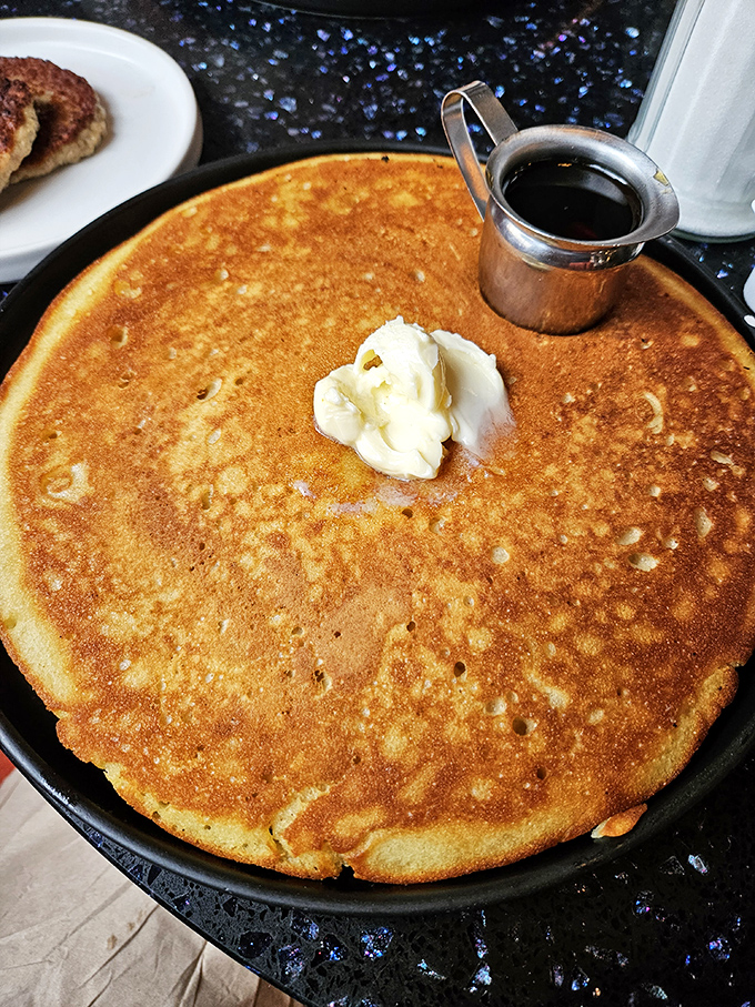 The pancake that launched a thousand return visits: perfectly golden, crater-pocked like its planetary namesake, with butter melting into a delicious solar flare.