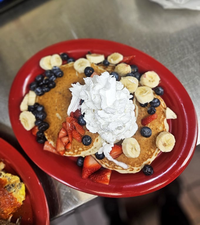 Golden pancakes stacked like edible architecture, proving breakfast can be both art and sustenance simultaneously.