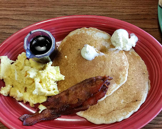 Golden pancakes that could make your grandmother jealous, served with eggs and bacon that would make even a rooster crow with delight.