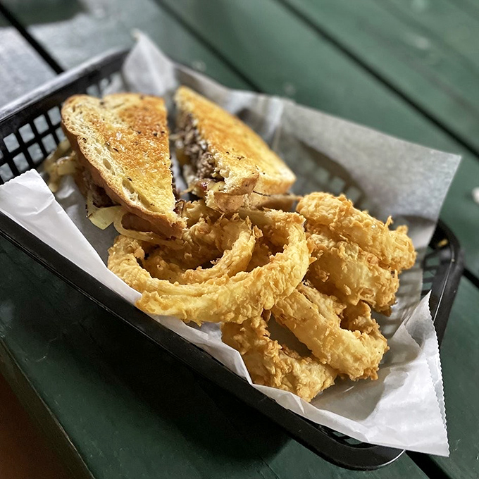 That's not just a sandwich with onion rings&mdash;it's edible architecture where every golden, crispy layer delivers a perfect balance of savory satisfaction.