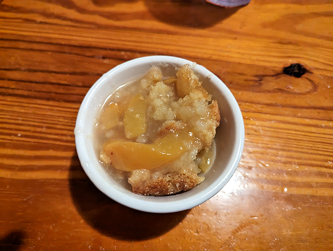 Behold the star attraction: peach cobbler that makes time stand still. That golden crust is the superhero cape this dessert deserves.