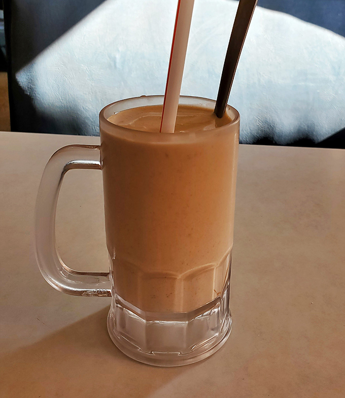 The peanut butter shake arrives like a creamy work of art&mdash;thick enough to require serious straw commitment but worth every bit of the effort. 