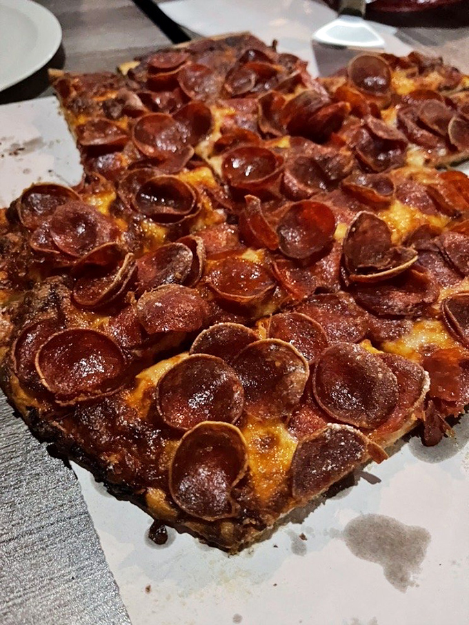 Those curled-up pepperoni cups are like little flavor hot tubs, holding precious pools of spicy oil that make each bite a magnificent event.