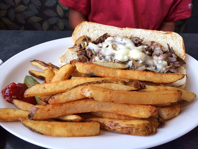 The holy grail of Lake Erie cuisine: a perfectly golden perch sandwich with those legendary fries. Poetry on a plate, folks.