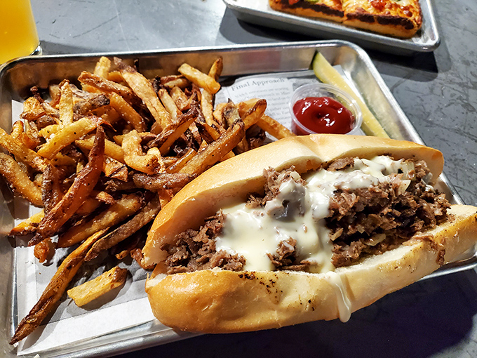 Behold, the star of our show! This cheesesteak isn't just a sandwich&mdash;it's a masterpiece of meat, melted cheese, and magnificent carbs that demands your full attention.
